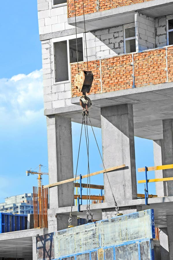 Crane hoisting formwork stock photo. Image of architecture - 55898210