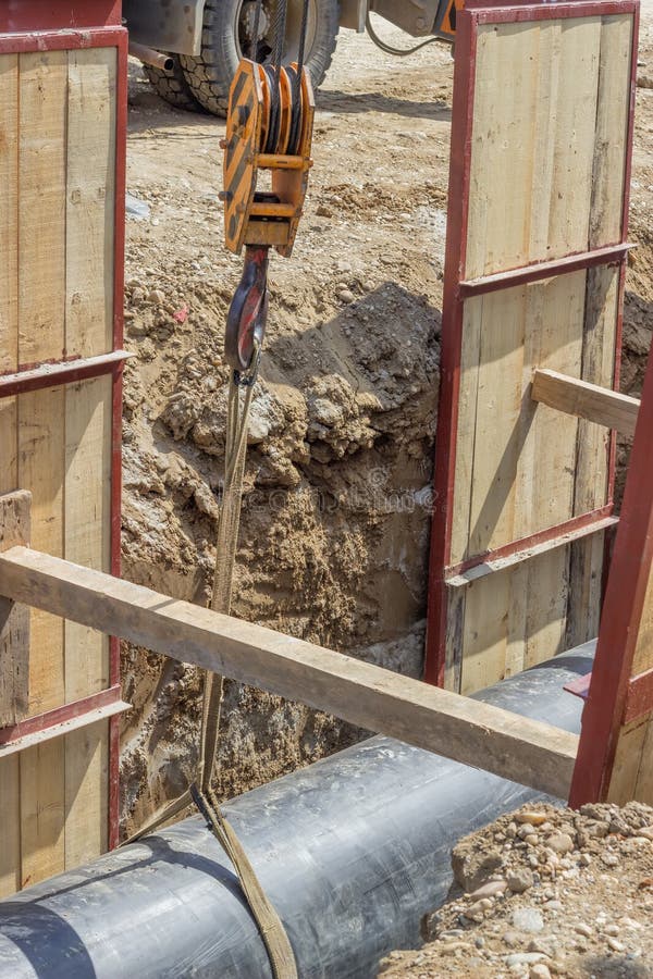 Crane Hook Hold Up Pipe in Trench 2 Stock Image - Image of chrome ...