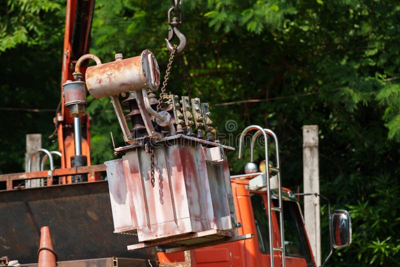 Crane Hook Lifts Up Old Distribution Transformer Stock Image - Image of ...