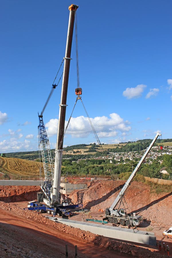 Crane laying a new bridge stock photo. Image of earth - 102086370