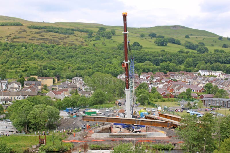 Crane laying a new bridge stock photo. Image of earth - 107950708