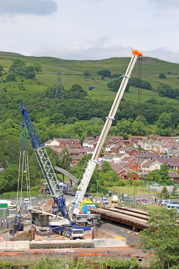 Crane laying a new bridge stock image. Image of heavy - 105342037