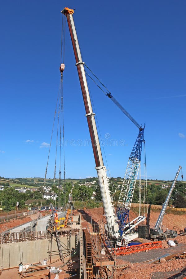 Crane Lifting a Bridge Beam Stock Image - Image of construction, works ...