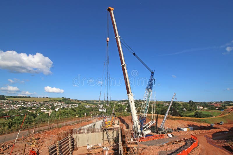 Crane Lifting a Bridge Beam Stock Photo - Image of truck, roadworks ...