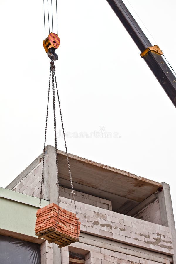 Crane lifting cargo stock image. Image of building, bear - 21895901