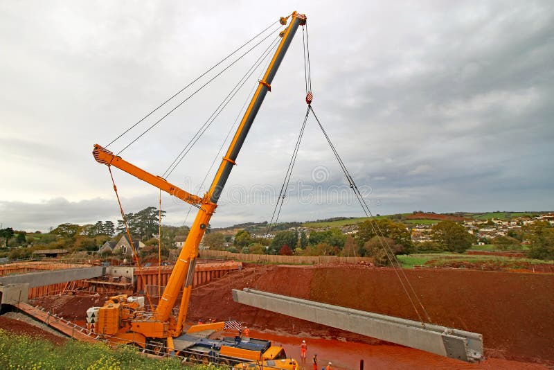 Crane Lifting a Concrete Beam Stock Photo - Image of road, roadworks ...