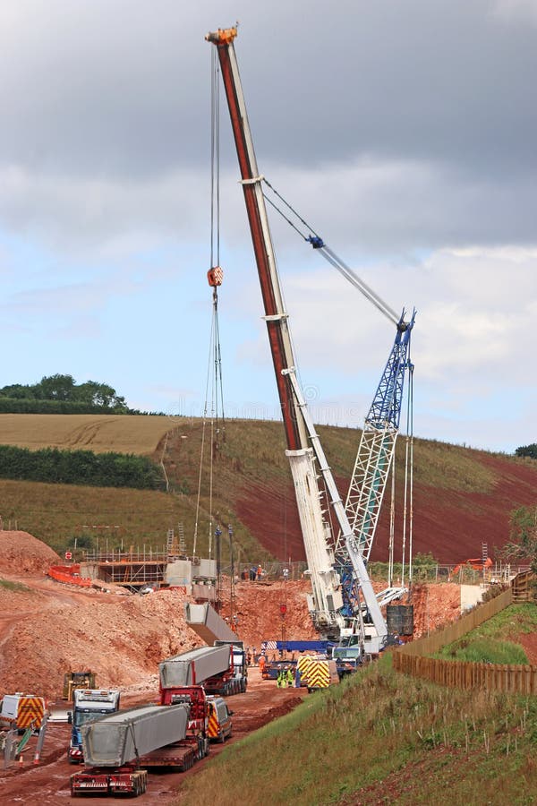 Crane Lifting a Concrete Bridge Beam Stock Photo - Image of lifting ...