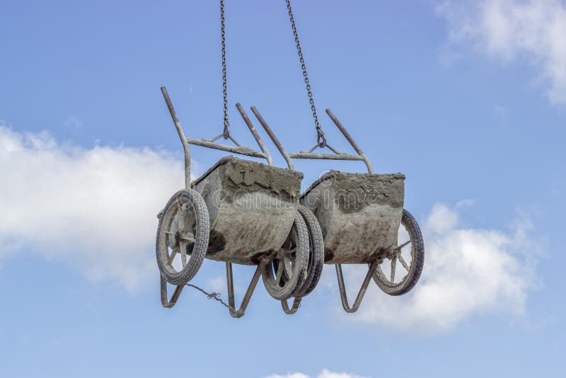 Crane Lifting Concrete Wheelbarrow at Constructoin Site Stock Photo ...