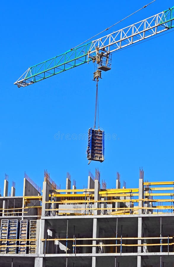 Crane lifting formwork stock photo. Image of apartment - 322726340