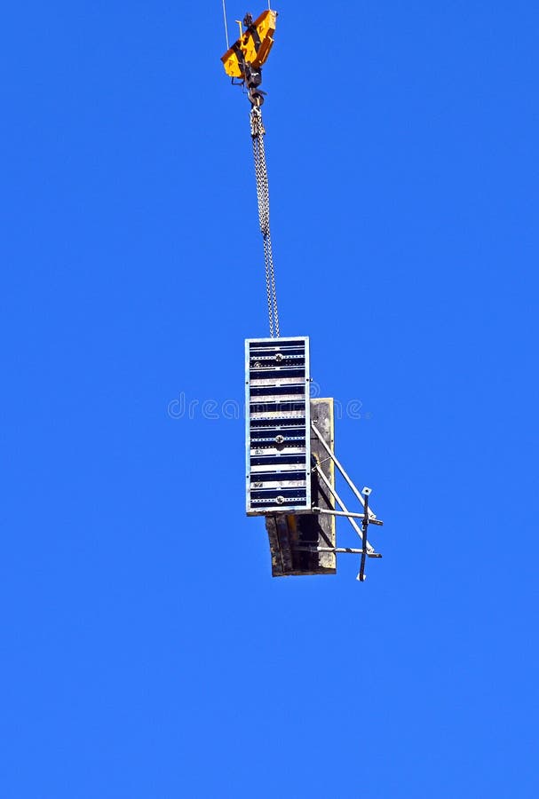 Crane lifting formwork stock photo. Image of scaffolding - 322627914