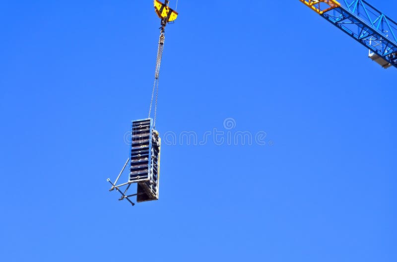 Crane lifting formwork stock photo. Image of formwork - 322726392