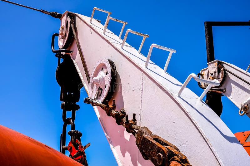A Crane is Lifting a Heavy Object Stock Photo - Image of harbor, anchor ...