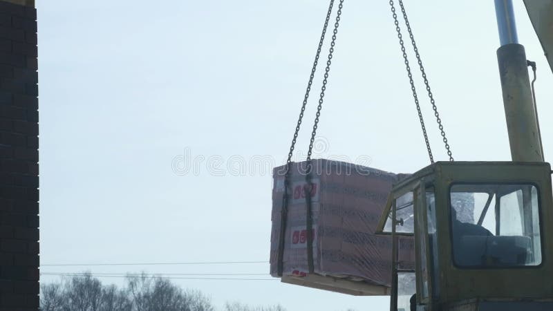 Crane Lifting Heavy Objects at Construction Site, Bustling with ...