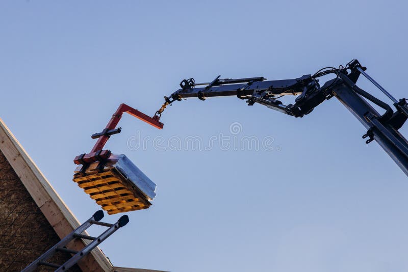 Crane Lifting Materials Roofing Construction at Work Stock Photo ...