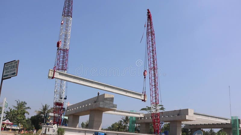 Crane Lifting Pillars for Flyover Construction - Bridge Stock Video ...