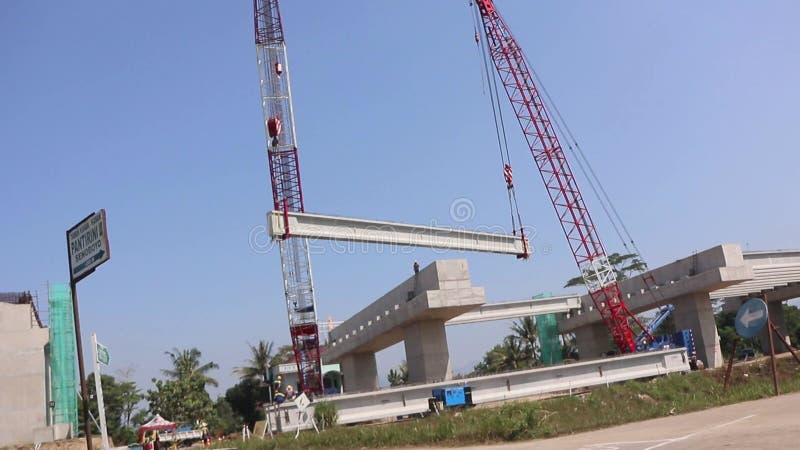 Crane Lifting Pillars for Flyover Construction - Bridge Stock Footage ...