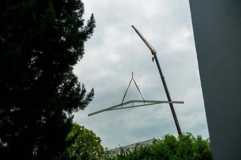 The Crane is Lifting the Steel Roof Structure Stock Image - Image of ...