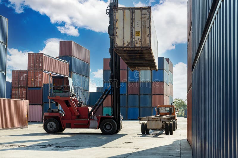 Crane Lifting Up Container in Railroad Yard. Crane Lifting Up Container ...