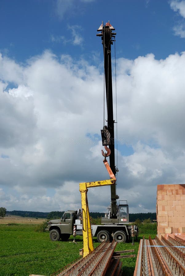 Crane lifts lintel stock image. Image of crane, level - 60389035