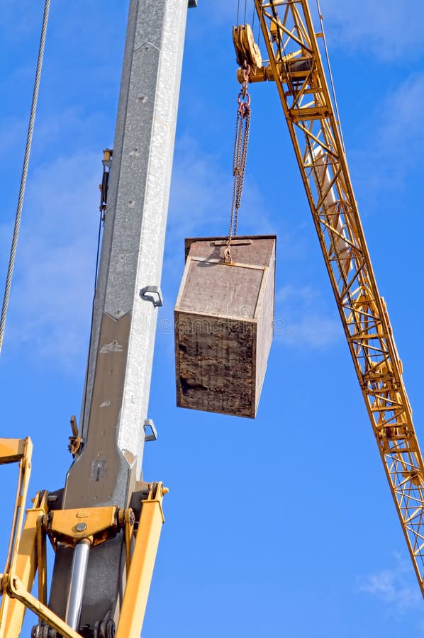 Crane with load stock photo. Image of hoisting, site - 23858774