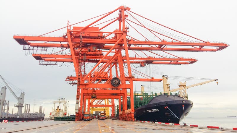 Crane loading a big tube editorial stock photo. Image of high - 23825608