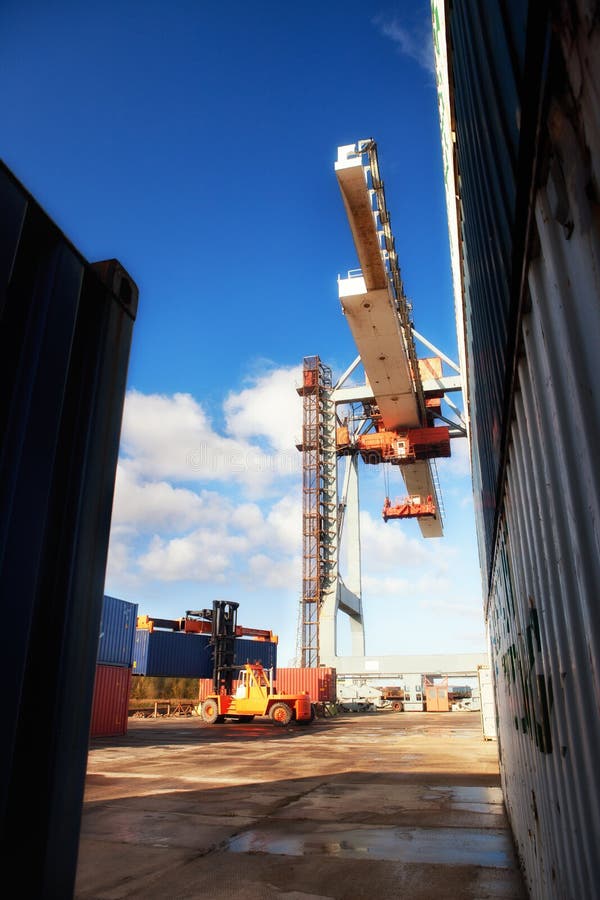 Crane Lowering Container To Stack of Containers. Stock Image - Image of ...