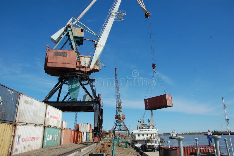 Crane Loading Metal Container To Ship at Kolyma River Port Editorial ...
