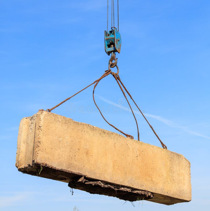 The Crane Loads Old Concrete Blocks at the Construction Site Stock ...