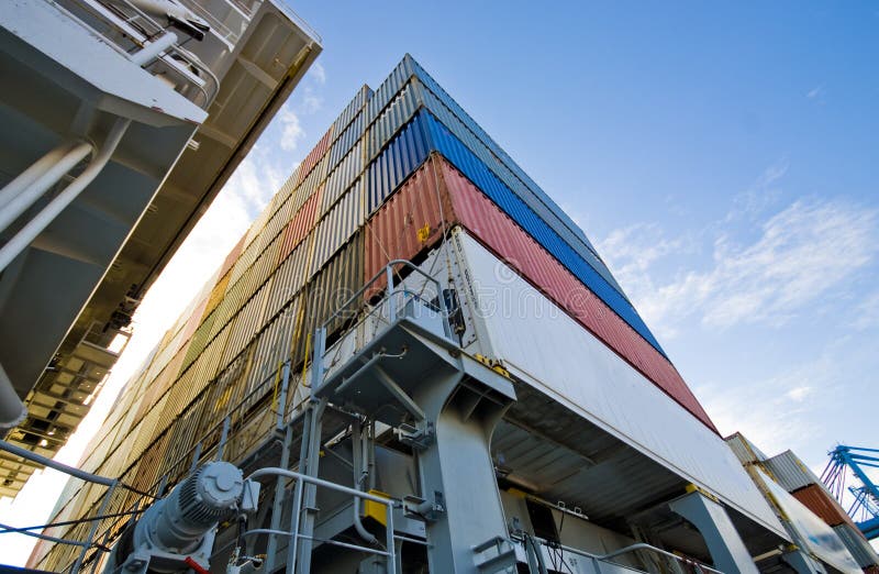 Crane Lowering Container To Stack of Containers. Stock Photo - Image of ...