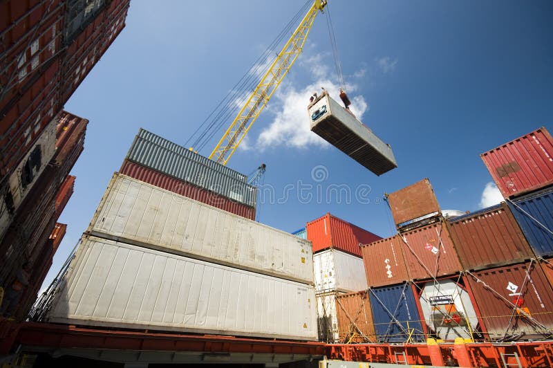 Crane Lowering Container To Stack of Containers. Stock Image - Image of ...
