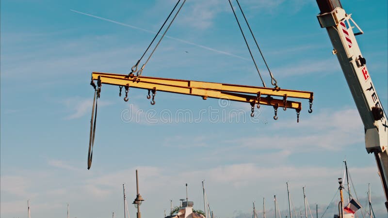 A Crane Machine Moving Around with the Blue Sky an Stock Footage ...