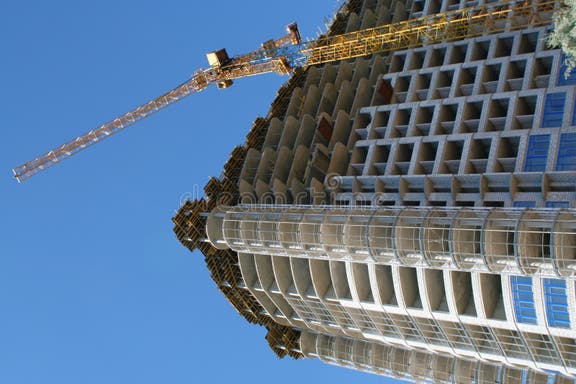 Crane near the skyscraper stock photo. Image of crane - 1734840