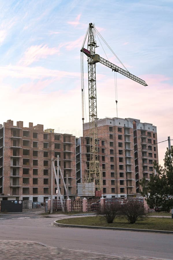 A Crane Operating on a Construction Site. Vertical Stock Image - Image ...