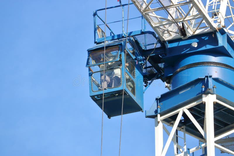 Crane Operator in Cabin stock photo. Image of lift, cable - 100428242