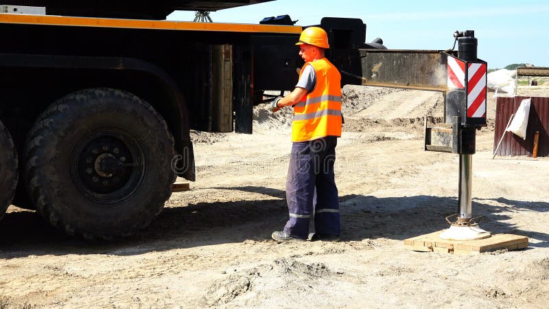 The Crane Operator Works with Controls and Devices on the Supporting ...