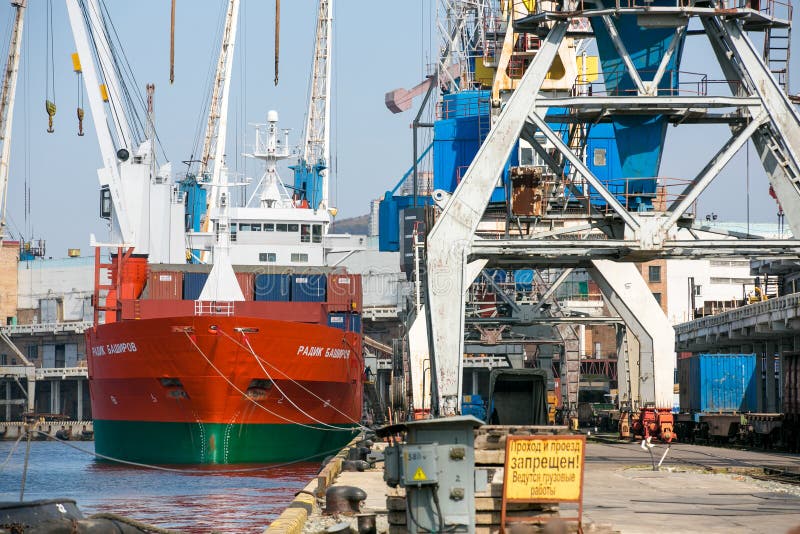 A Crane Performs Loading and Unloading Operations at the Seaport ...