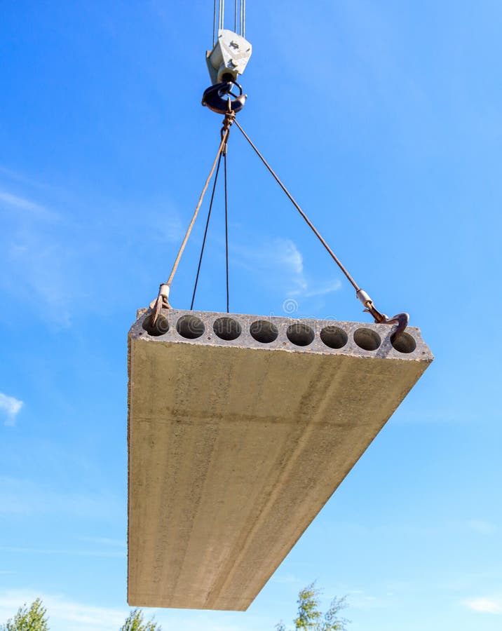 A Crane Raised a Concrete Slab at a Construction Site at Home Stock ...