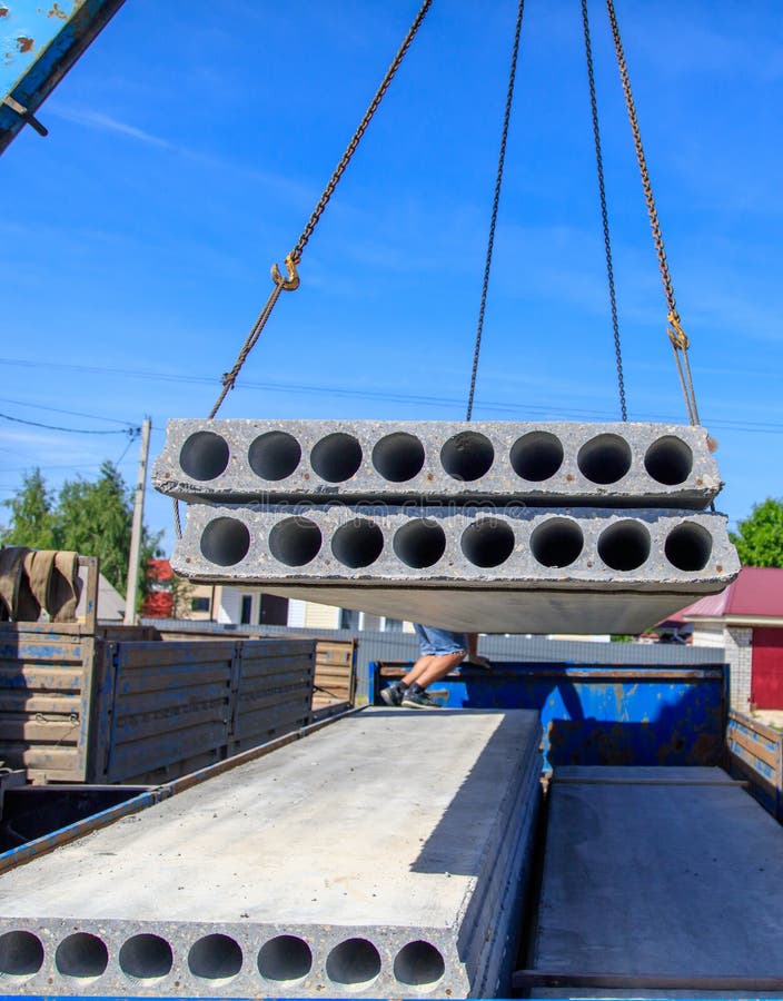 A Crane Raised a Concrete Slab at a Construction Site at Home Stock ...