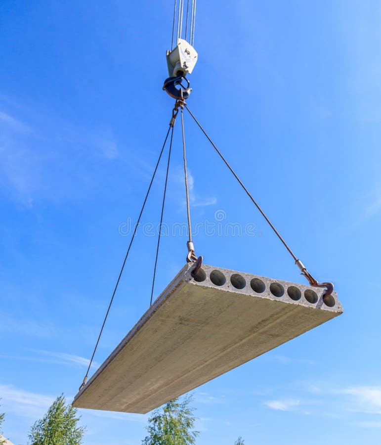 A Crane Raised a Concrete Slab at a Construction Site at Home Stock ...