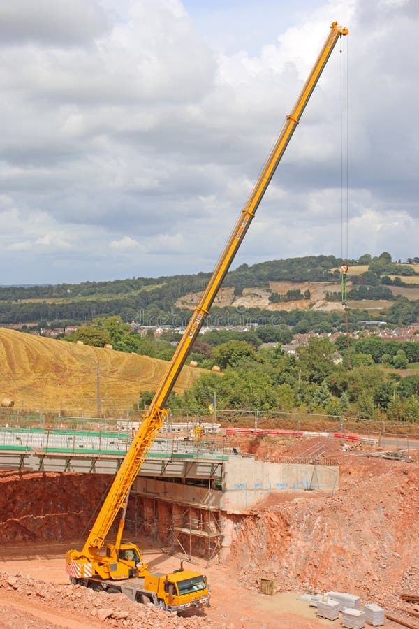 Crane on a Road Construction Site Stock Photo - Image of spar, roller ...