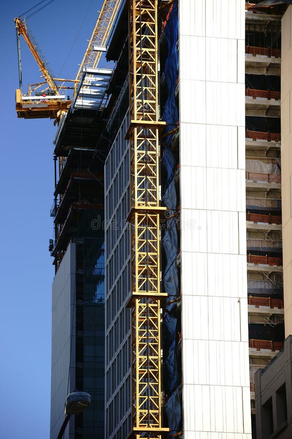 Crane on skyscraper stock image. Image of cabin, shell - 65841311