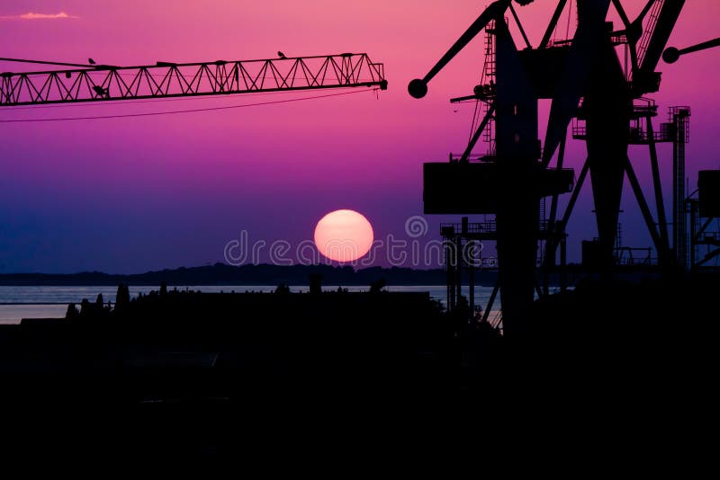 Crane on sunset stock photo. Image of metal, shipbuilding - 16744004