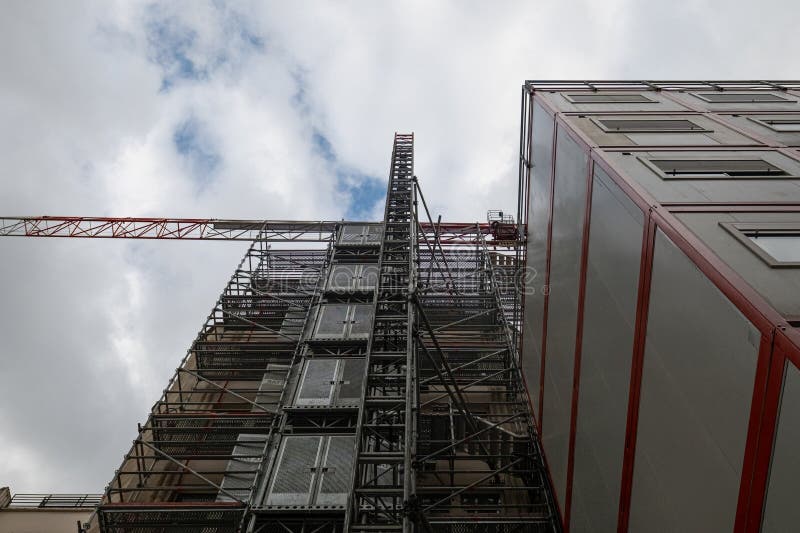A Crane System at Work on a Building Renovation in Paris Stock Photo ...