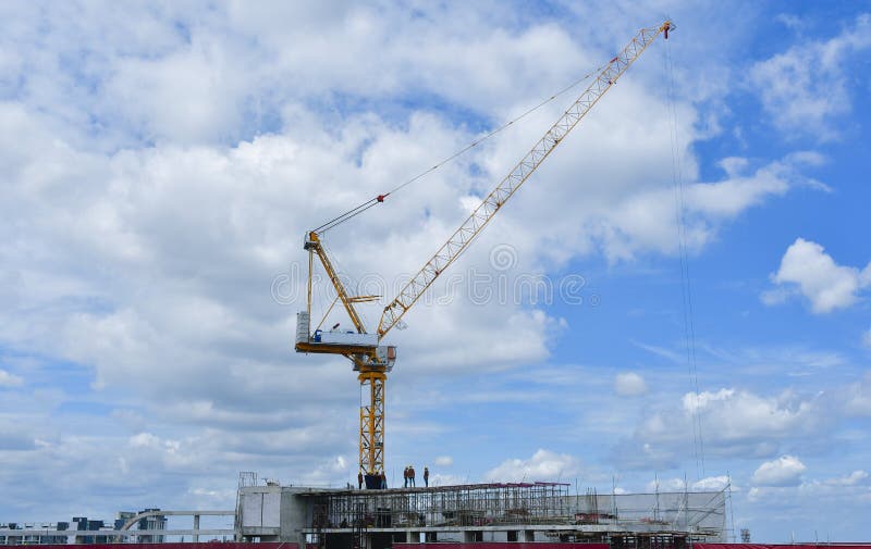 The Crane Tower in Construction Site of a High-rise Condominium Stock ...
