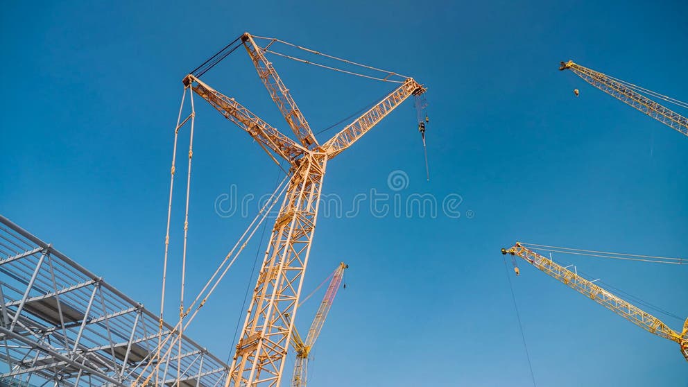 Crane Towers in the Process of Hoisting Metal Structures for Stadium ...