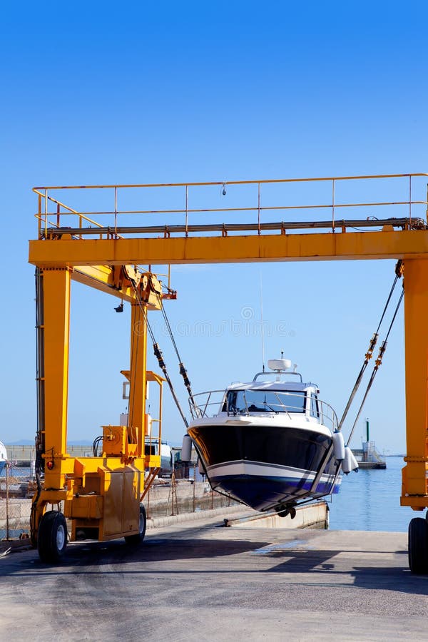 Crane Travelift Lifting a Boat on Blue Sky Day Stock Image - Image of ...
