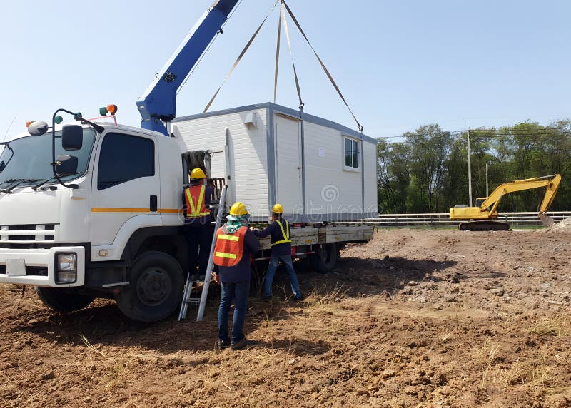 The Crane Trucks Transport the Mobile Office Buildings or Container ...