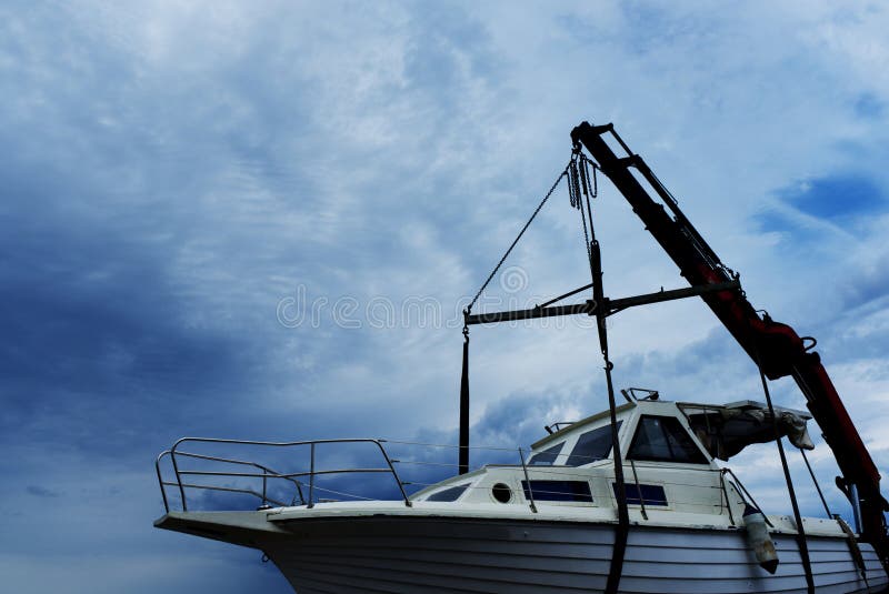 Crane Unloading a Boat into the Water Stock Image - Image of transport ...