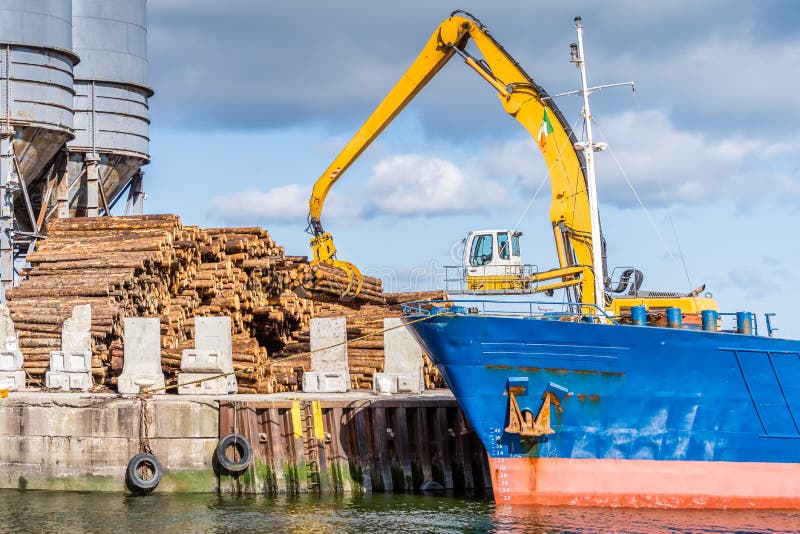 Crane with Wood Logs Gripple Loading Timber on Cargo Ship Stock Image ...