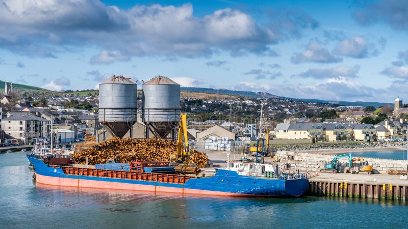 Crane with Wood Logs Gripple Loading Timber on Cargo Ship Stock Photo ...